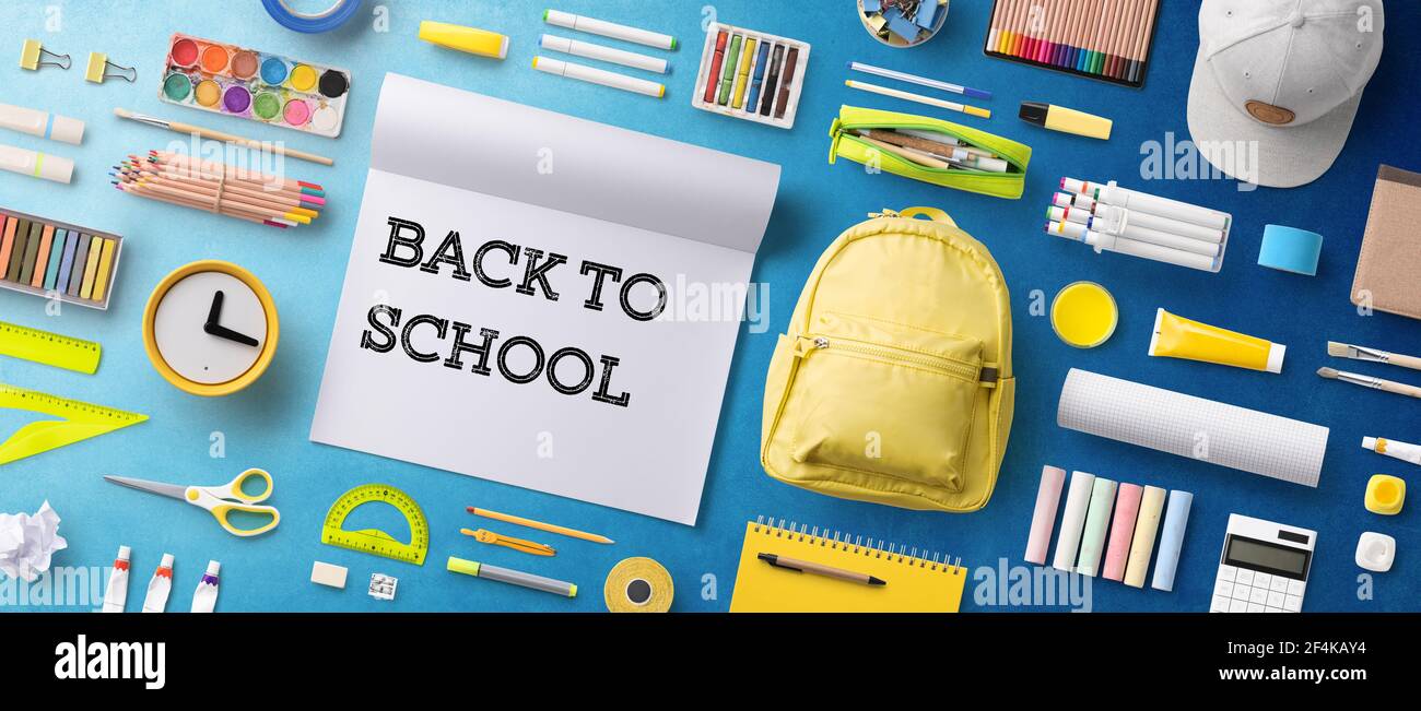 Flat lay top view of bag and school supplies, back to school concept ...