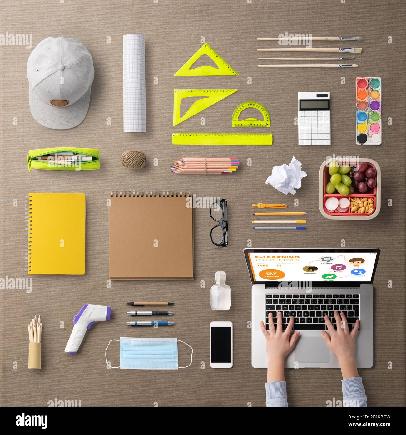 Flat lay top view of school supplies, distance learning and coronavirus ...