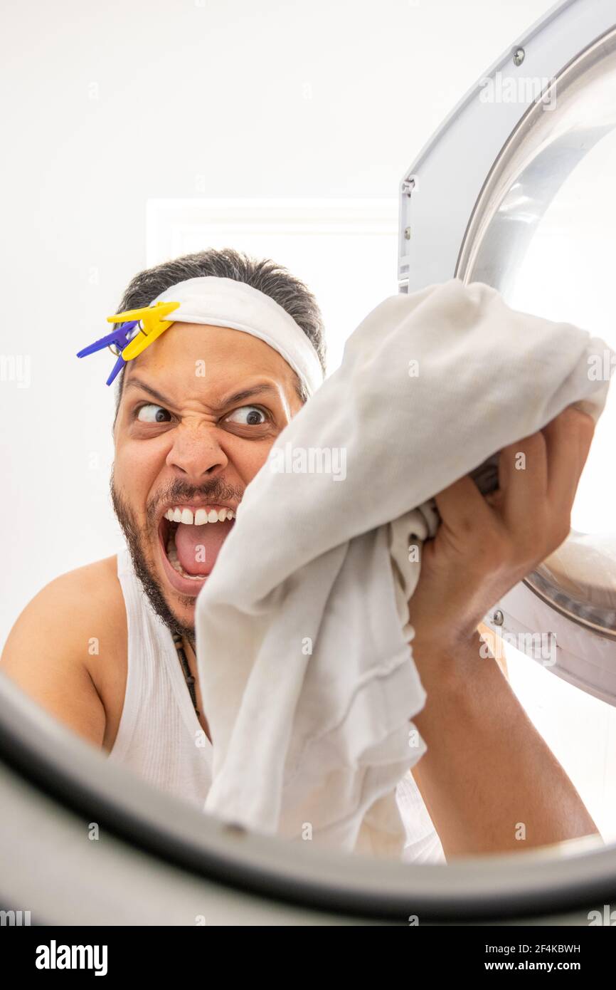 Man washing clothes by hand hi-res stock photography and images - Alamy