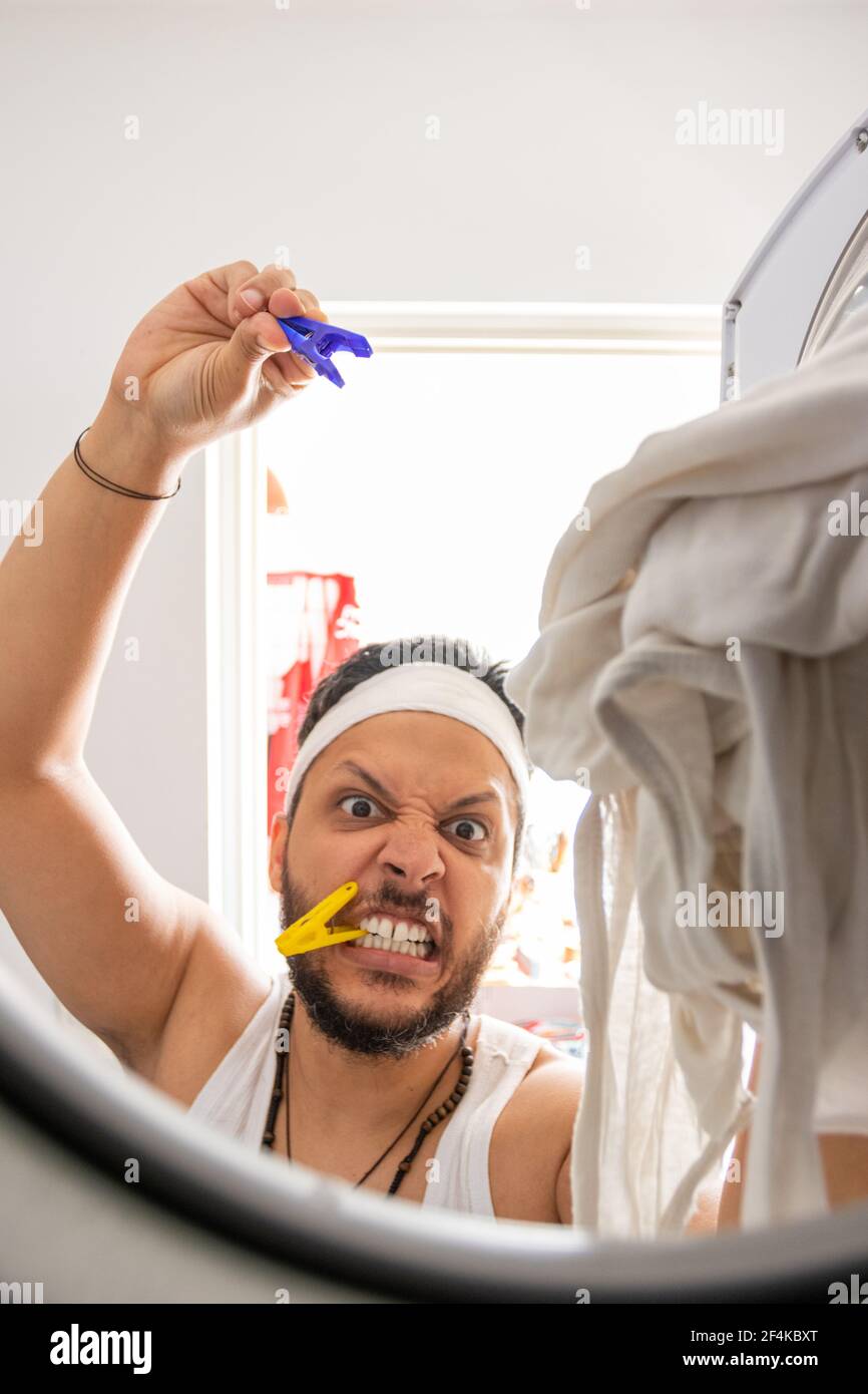 Man washing clothes by hand hi-res stock photography and images - Alamy