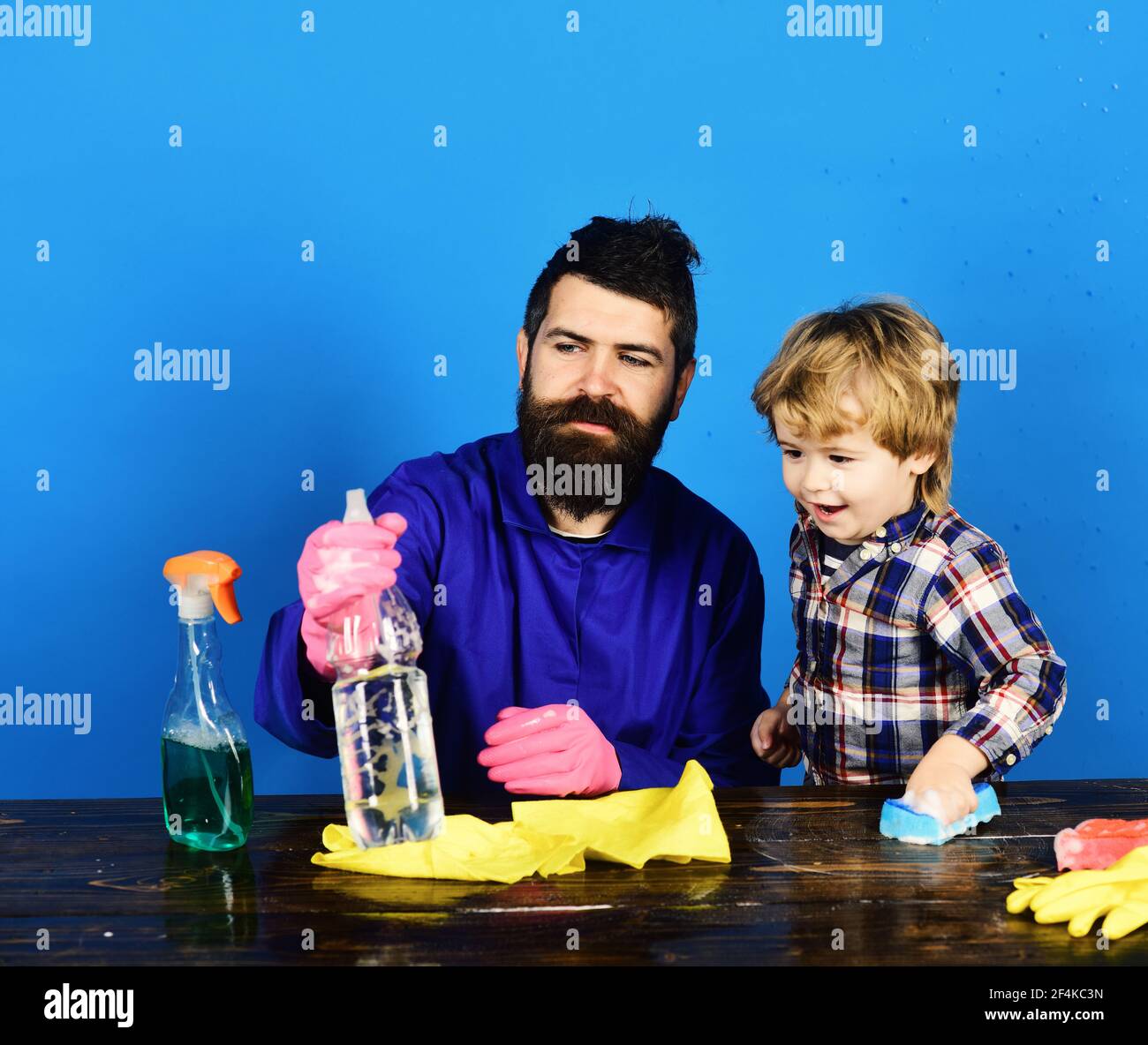 Father and son plays with cleaning props Stock Photo - Alamy