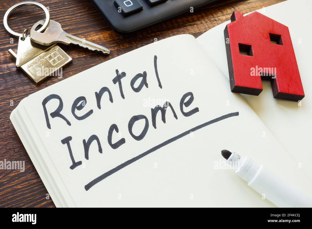 Rental income calculations on the page and key Stock Photo - Alamy