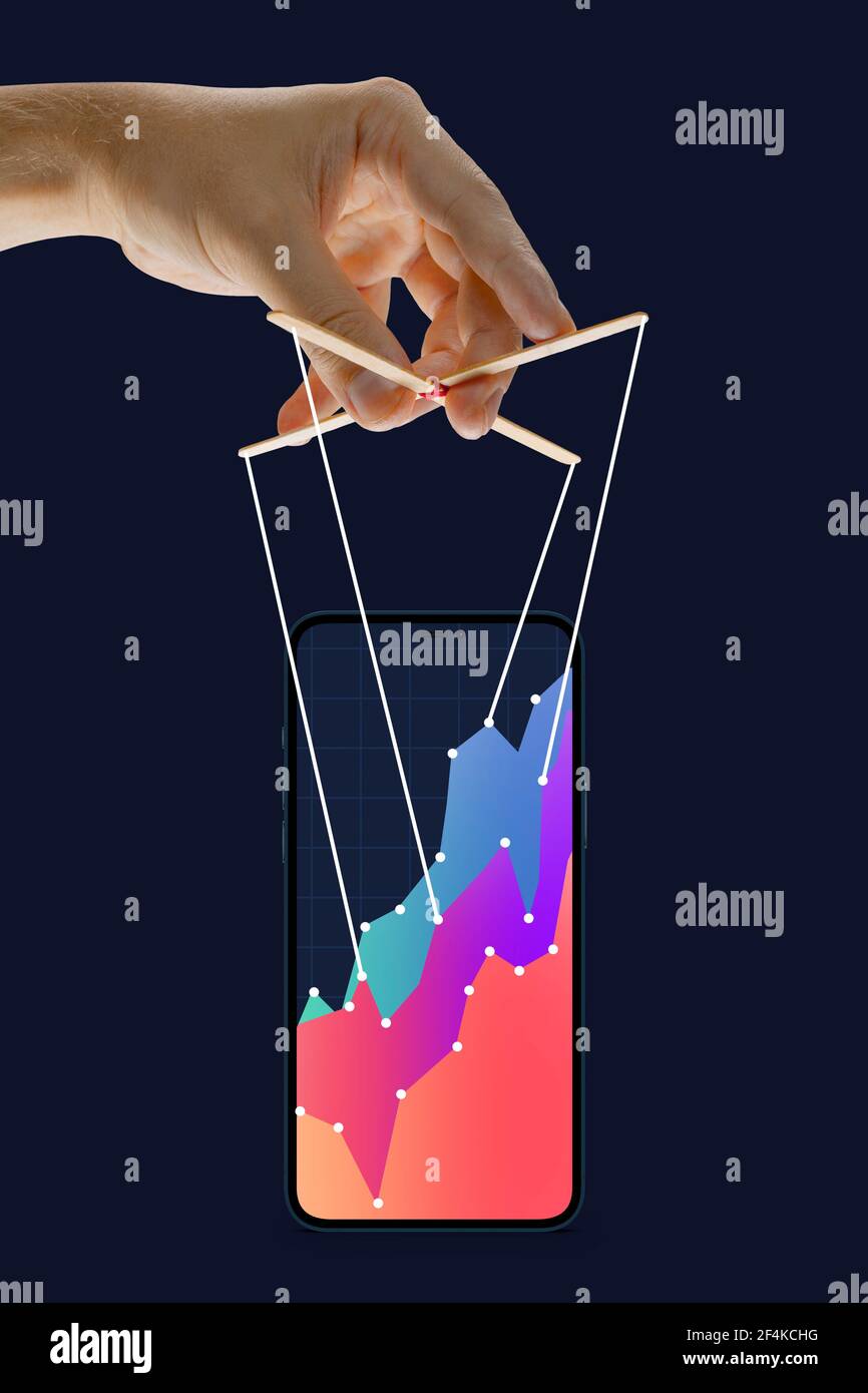Businessman keeping the growth in economy, manipulating graphs like ...