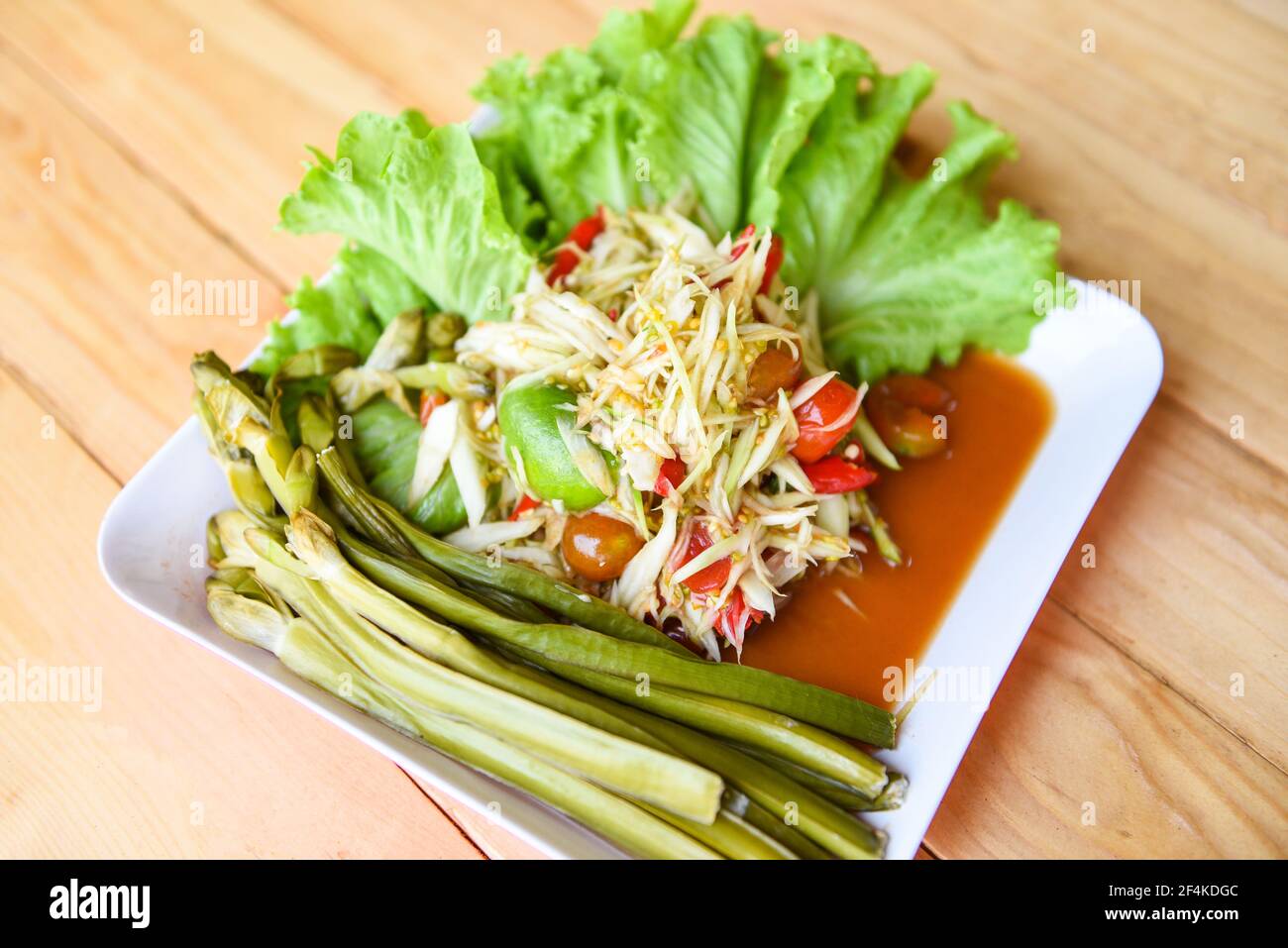 Spicy green papaya salad, Traditional Thai food Stock Photo - Alamy