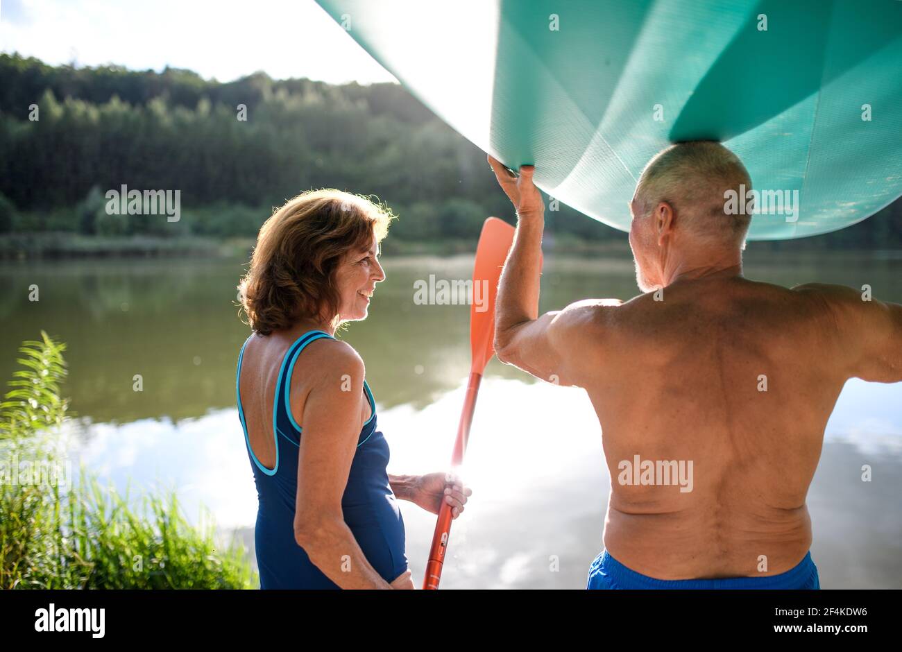 Senior man paddleboarding hi-res stock photography and images - Alamy