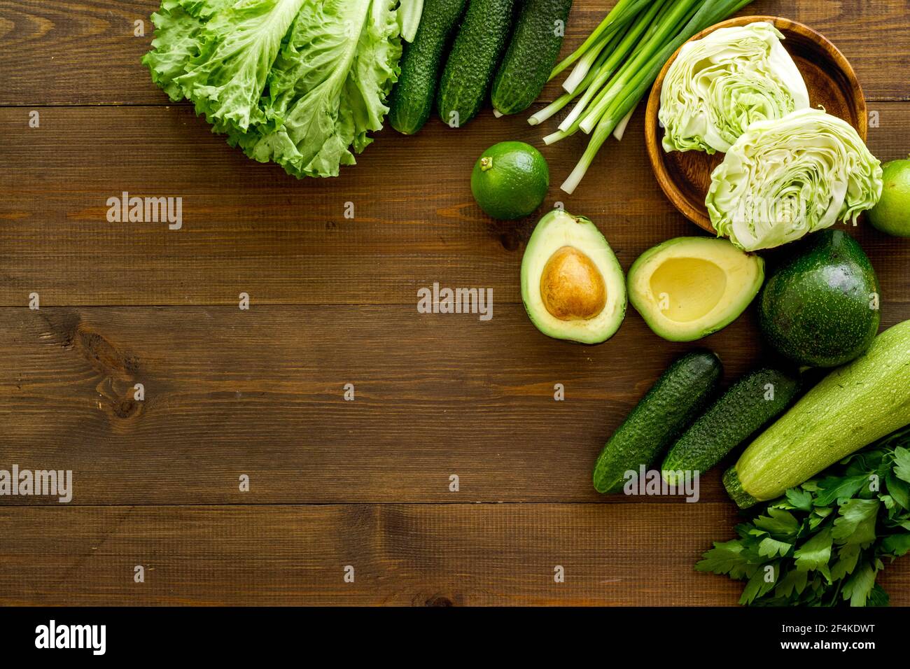 Layout of raw green vegetables, top view Stock Photo - Alamy