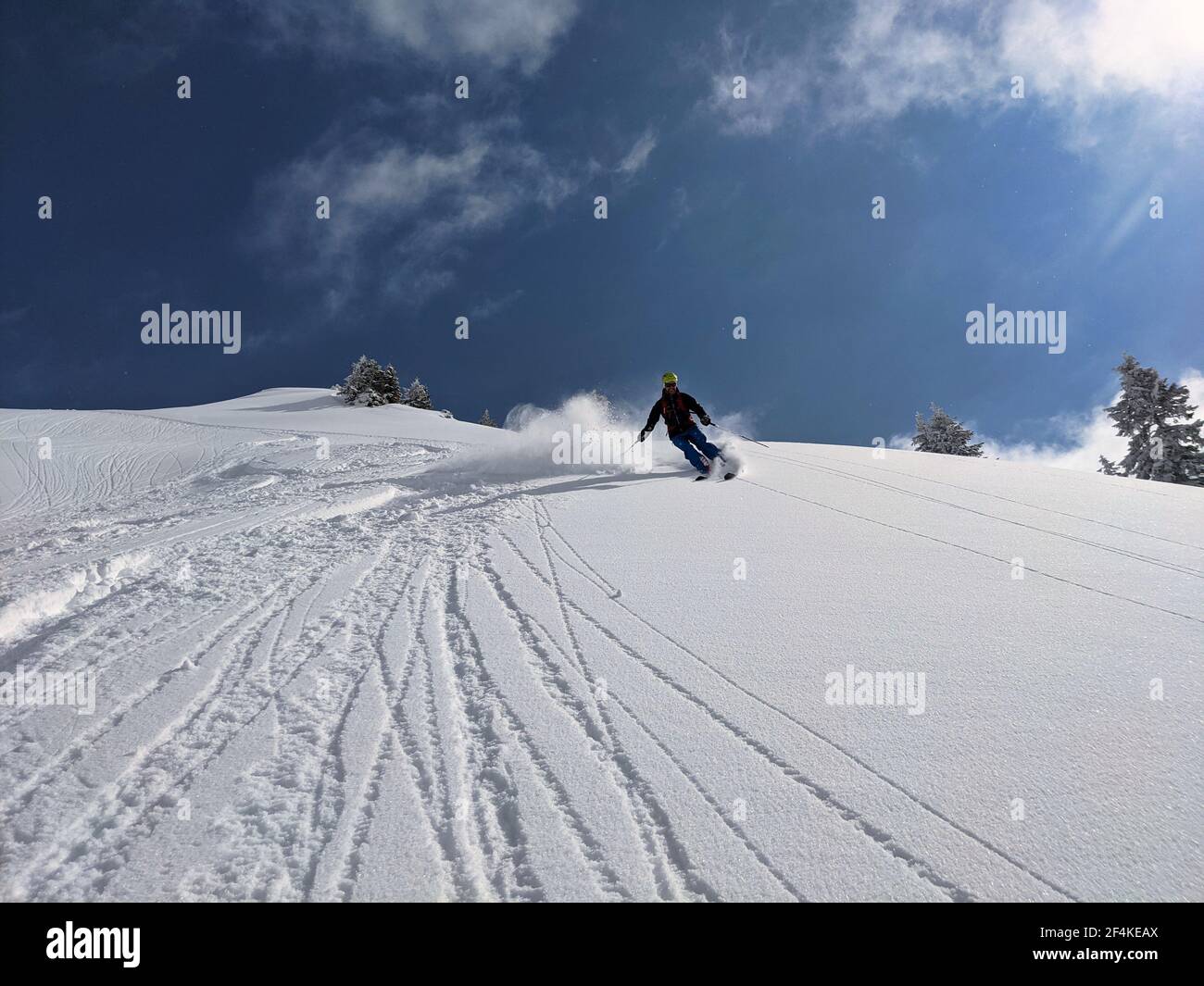 Freerider downhill mountain Silberen in powder snow. Ski tour in the Swiss mountains. Young man ...