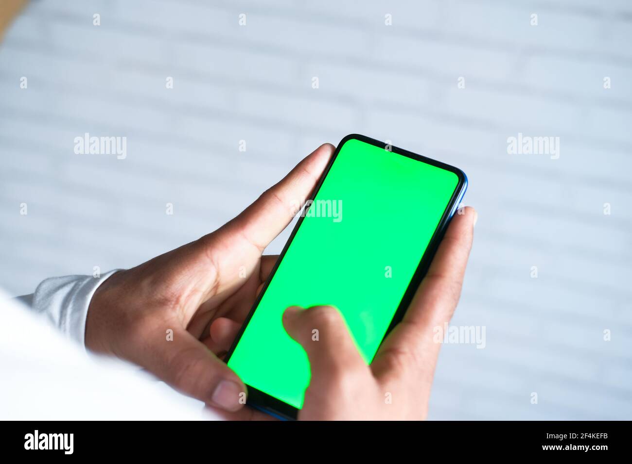 Rear view hand using smart hi-res stock photography and images - Alamy