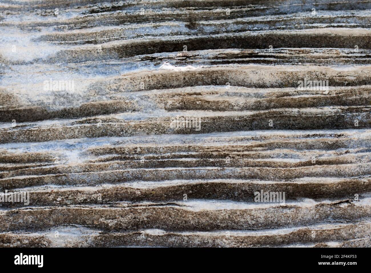 Rock background with white details Stock Photo - Alamy