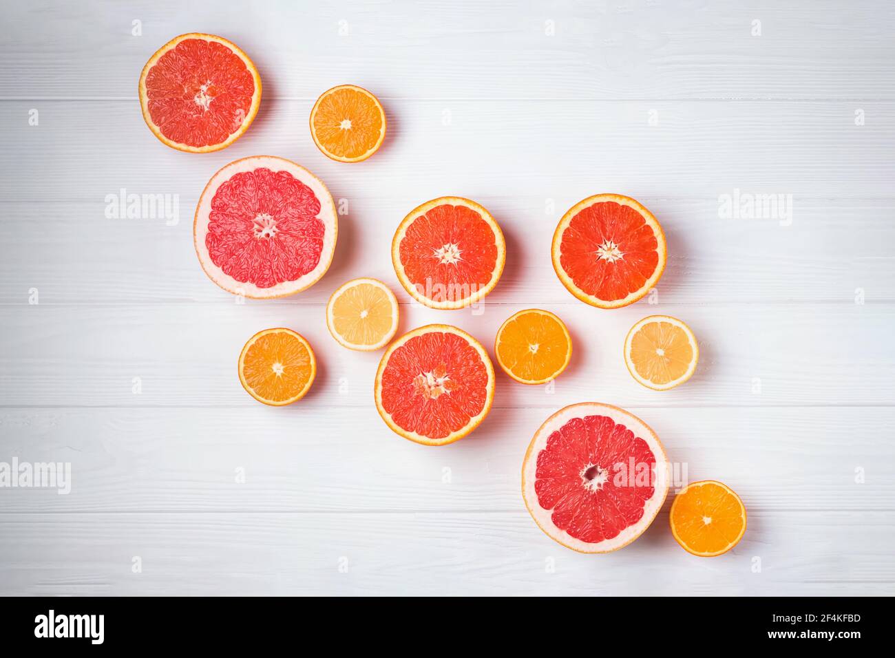 Flat lay composition with halves of different citrus fruits Stock Photo ...