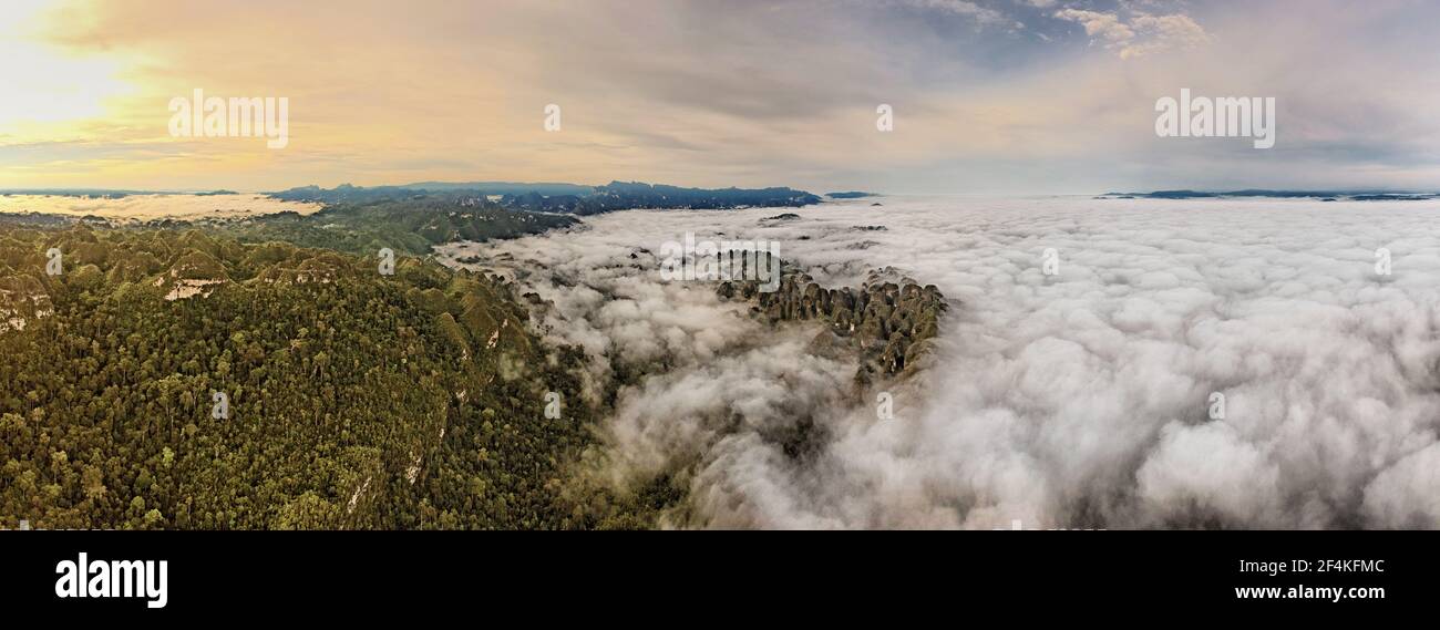 Aerial panoramatic morning view of rocks and Ketepu peak with clouds in ...