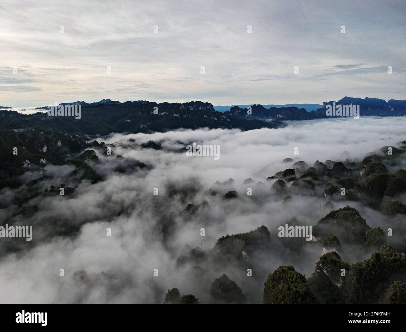 Aerial panoramatic morning view of rocks and Ketepu peak with clouds in ...
