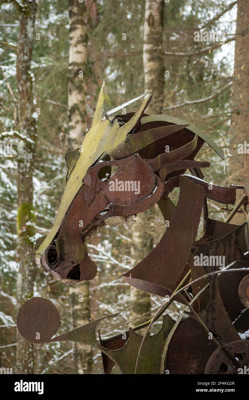 Creepy horse face in a wood, rusted iron sculpture, vertical Stock ...