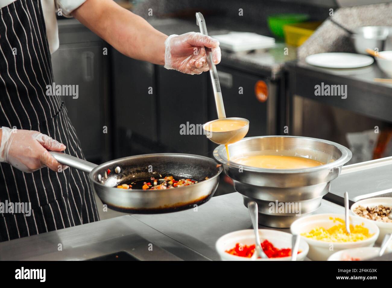 Chef in professional kitchen cooks hi-res stock photography and images ...