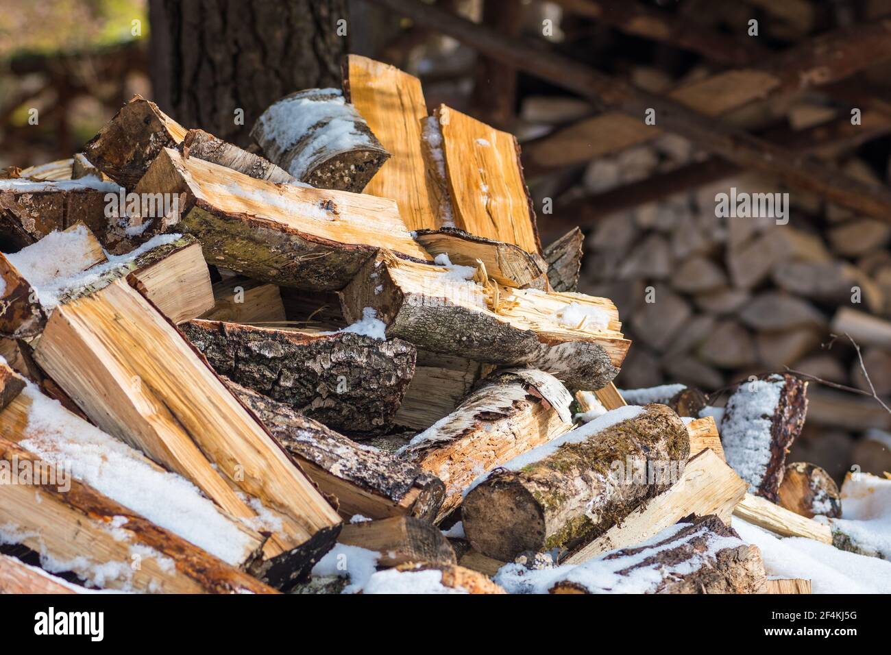 Stack or pile composed of blocks, pieces or logs of wood in winter or ...