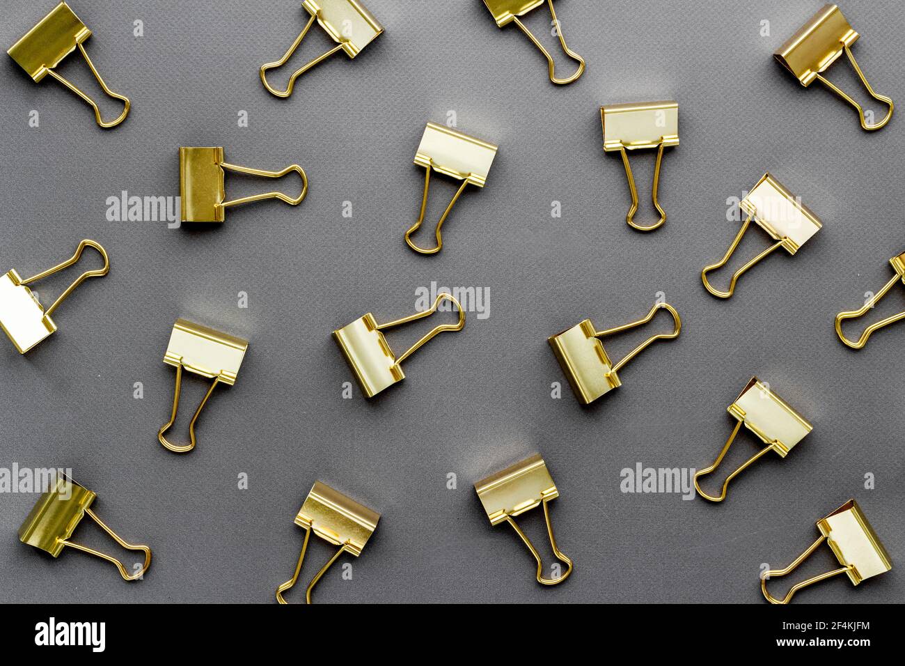 Flat lay of paper binder clips, office supplies pattern Stock Photo - Alamy