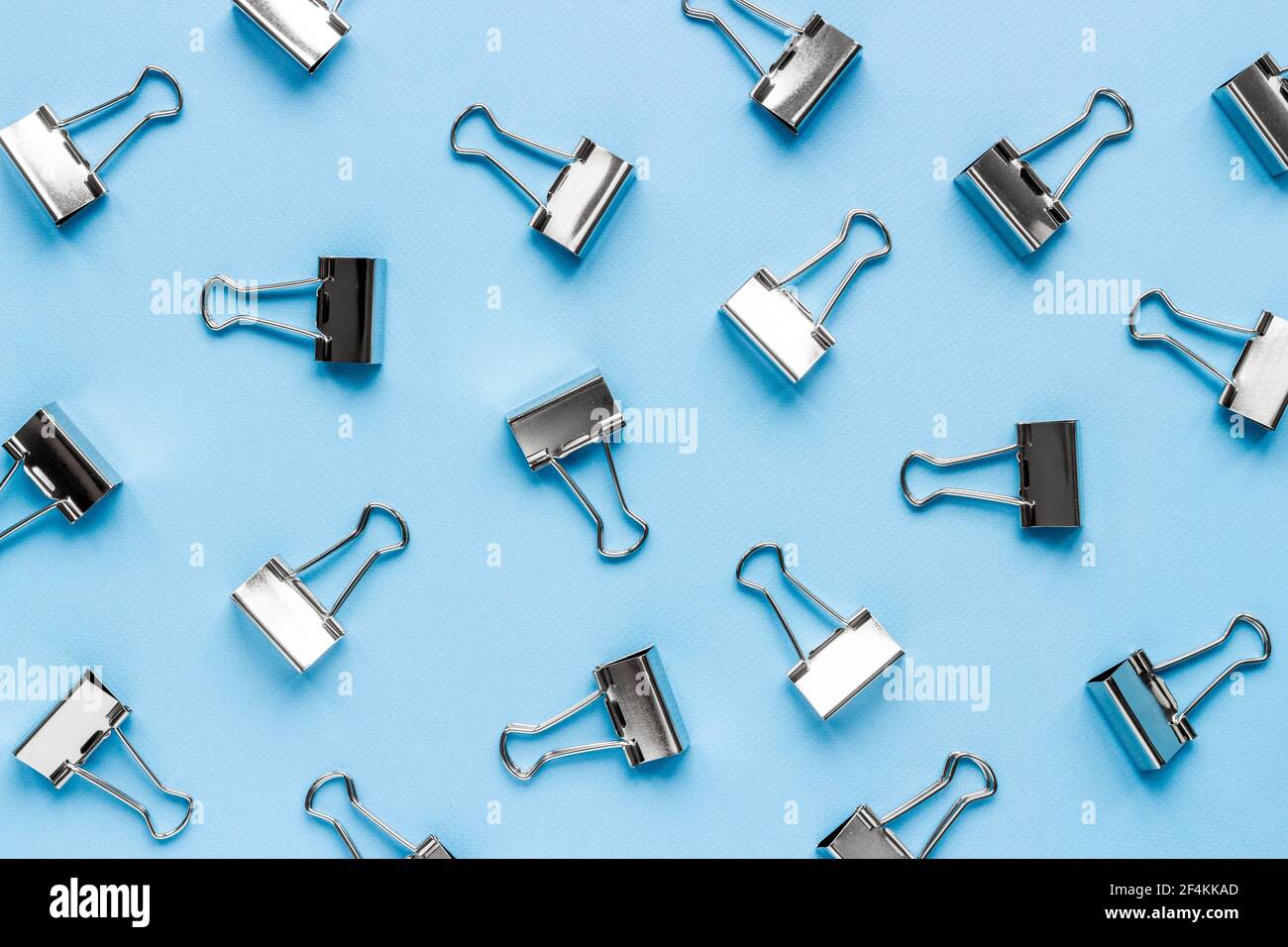 Paper binder clips pattern, copy space. Office supplies background ...