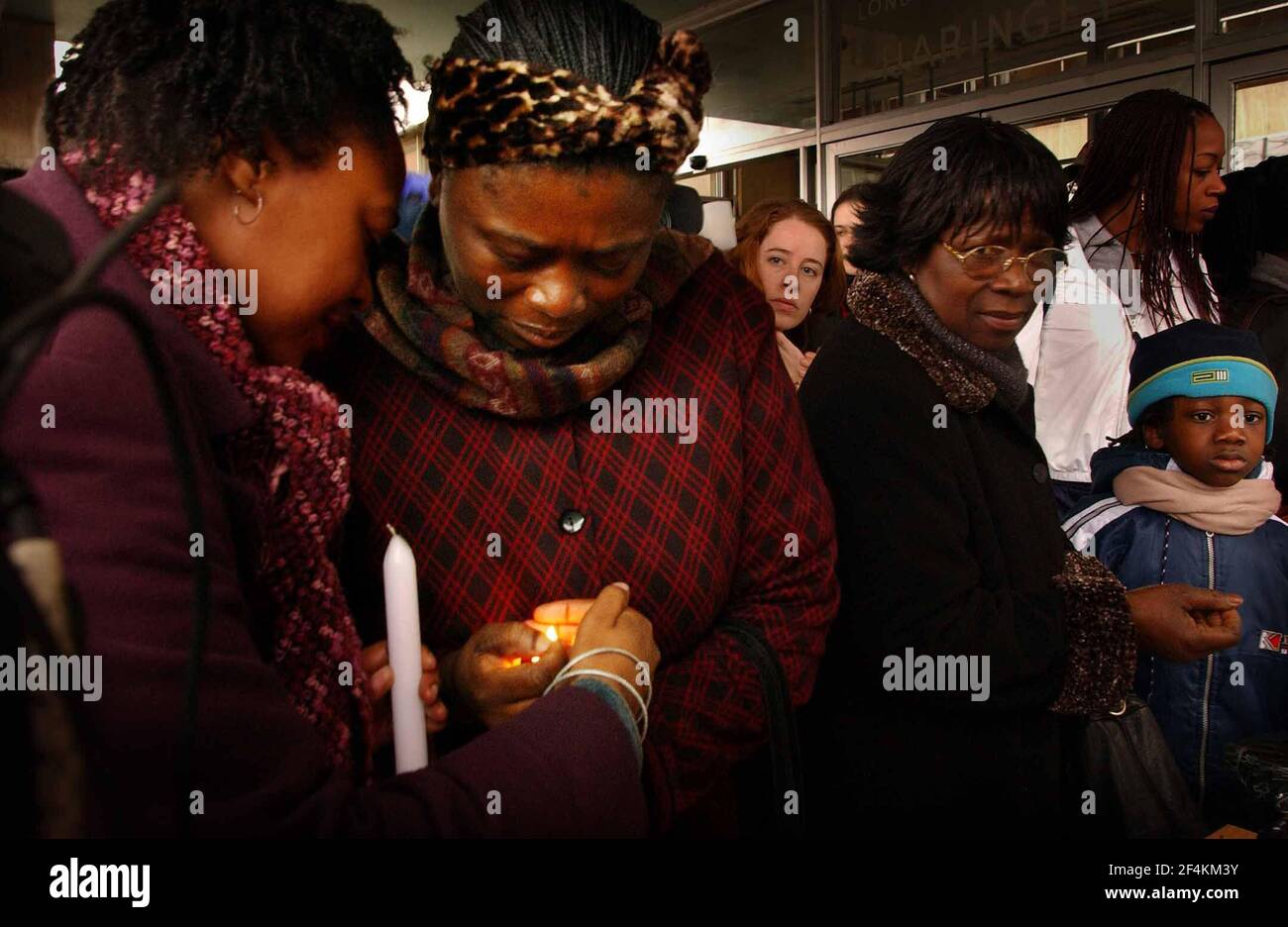 THE MOTHER OF VICTORIA CLIMBIE LIGHTS A CANDLE AT A VIGIL TO MARK THE ...