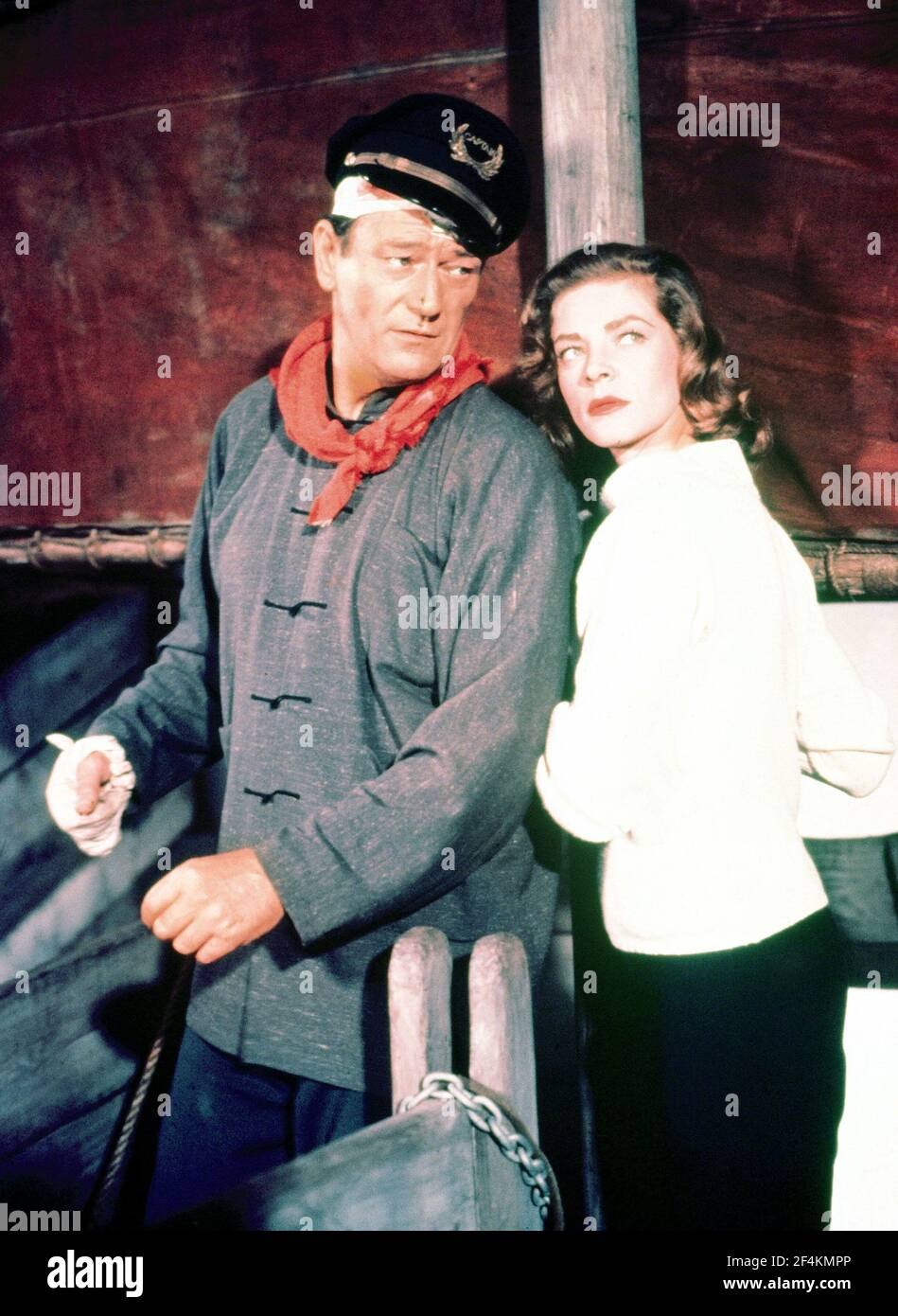 LAUREN BACALL and JOHN WAYNE in BLOOD ALLEY (1955), directed by WILLIAM ...