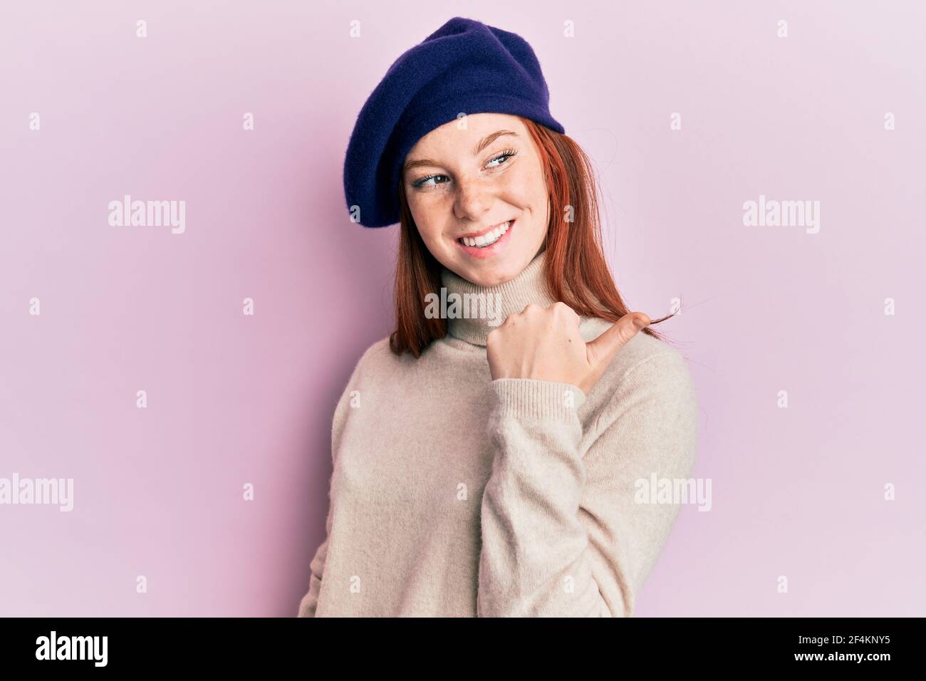 Young red head girl wearing french look with beret smiling with happy ...