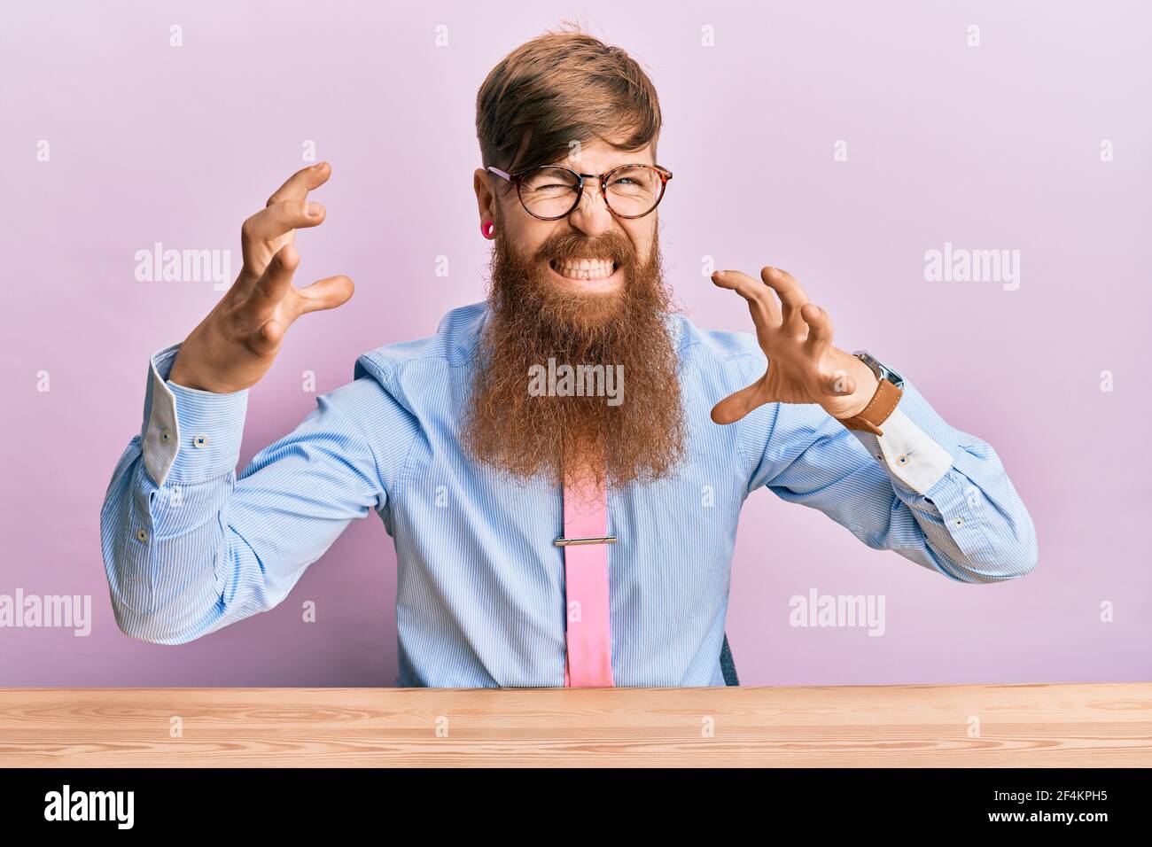 Young irish redhead man wearing business shirt and tie sitting on the ...