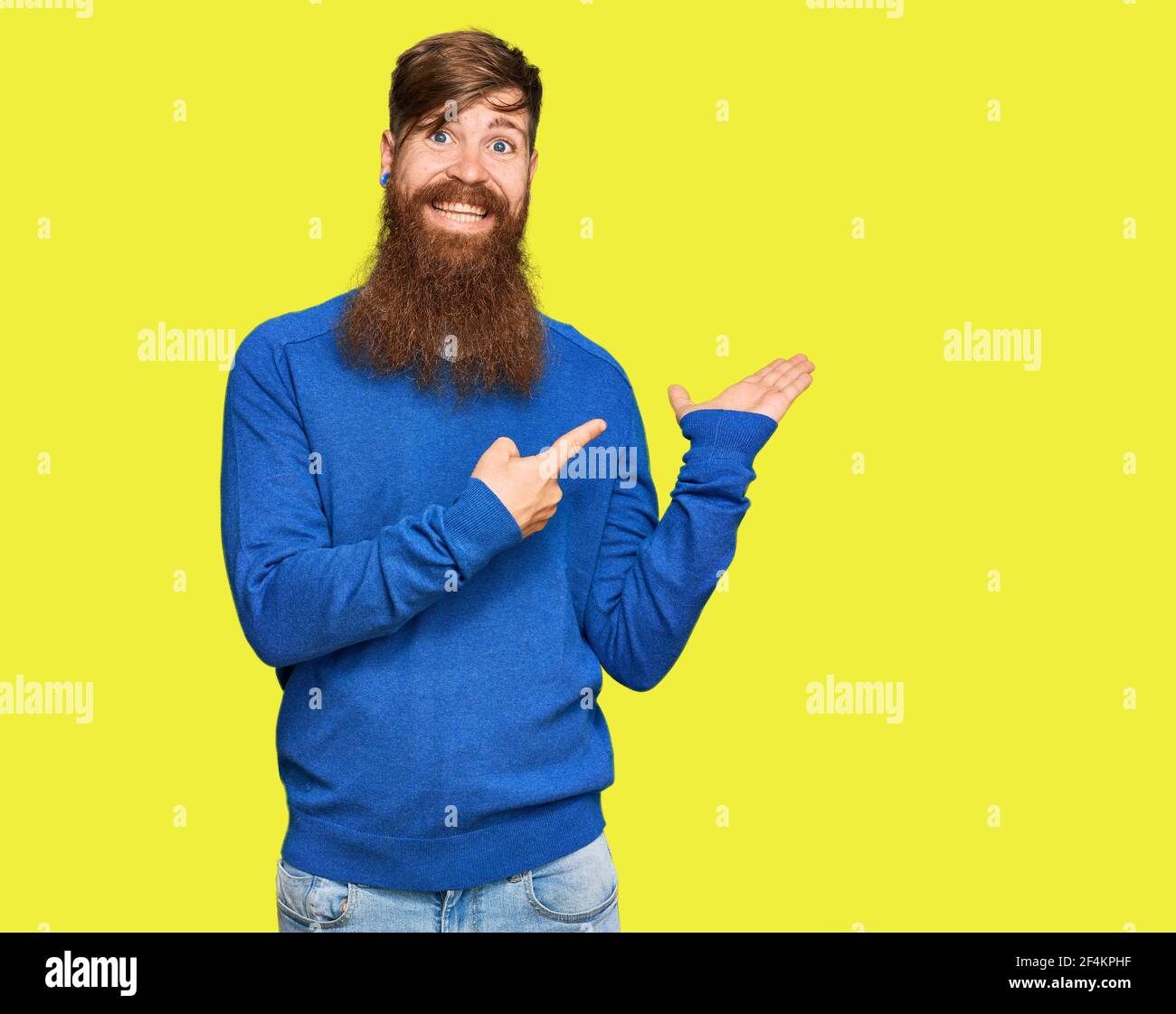 Young irish redhead man wearing casual clothes amazed and smiling to ...