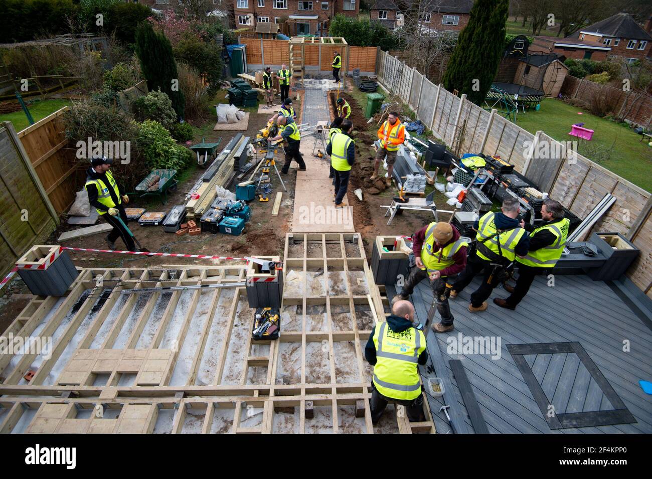 Volunteers from the charity Band of Builders at work in the garden of ...