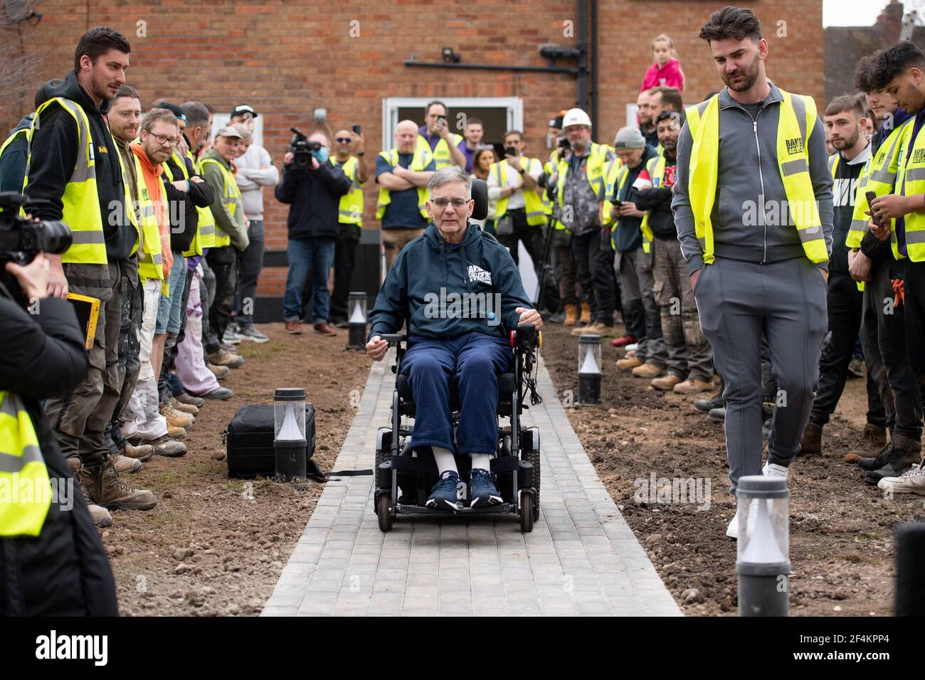 Rob Lamb is shown around the modified garden at his home in Solihull ...