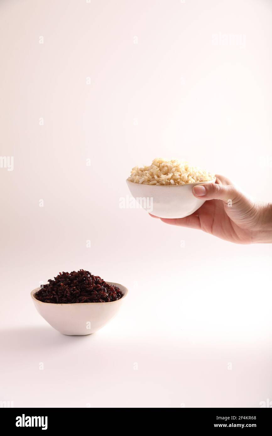 Organic boiled brown rice on bowl isolated in white background Stock ...