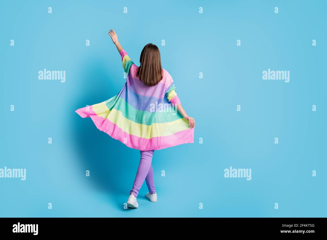 Full body rear portrait of satisfied person arm rise up wear purple ...