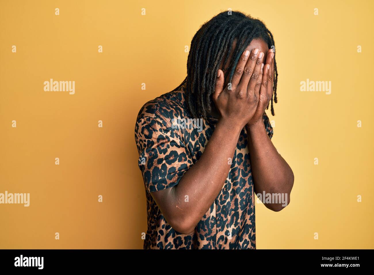 African american man with braids wearing leopard animal print shirt ...