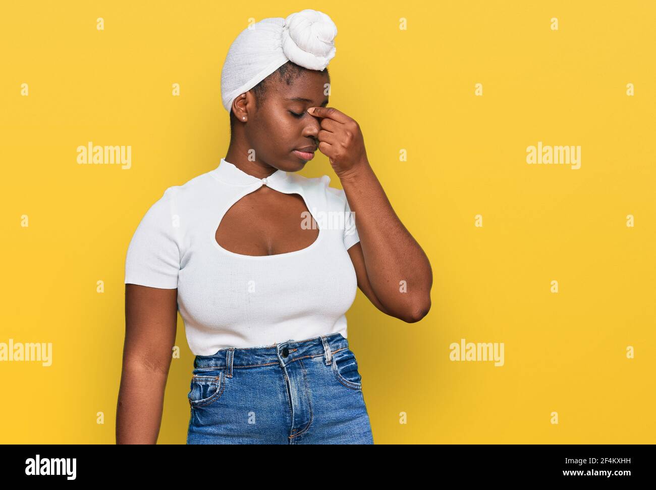 Young african woman with turban wearing hair turban over isolated ...