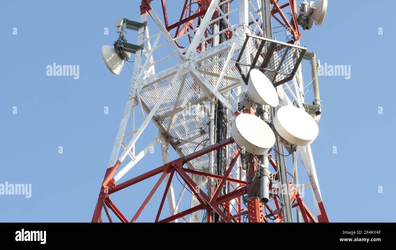 Telecommunication Cellular Tower Against Blue Sky Stock Photo - Alamy