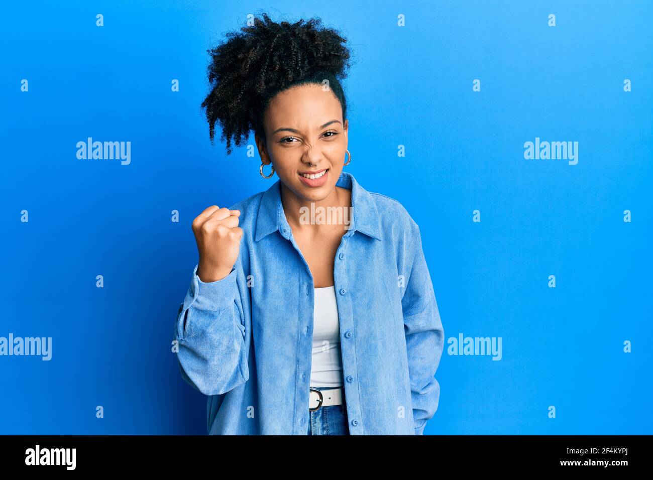Young african american girl wearing casual clothes angry and mad ...