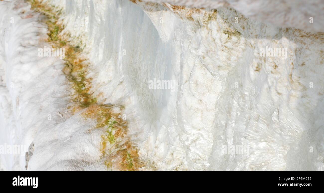 Stone white texture Pamukkale hill mountain surface in Turkey. Calcium ...