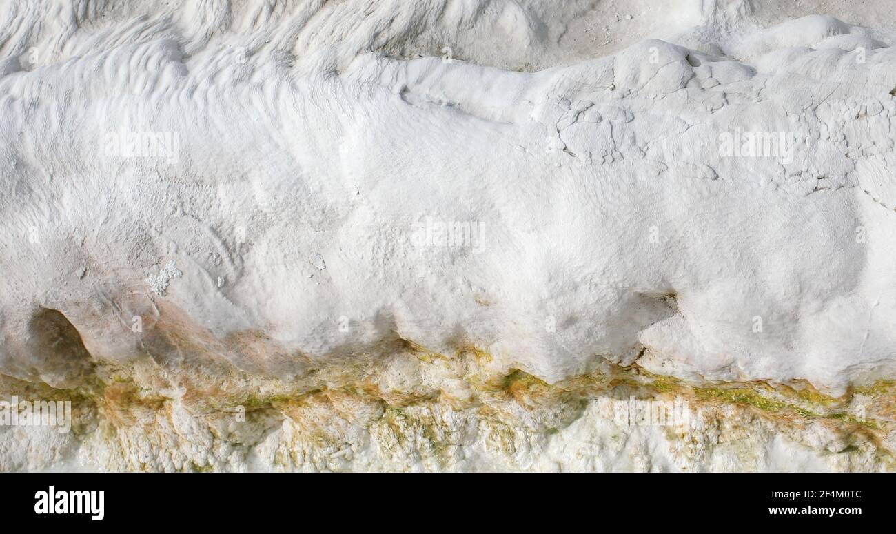Stone white texture Pamukkale hill mountain surface in Turkey. Calcium ...