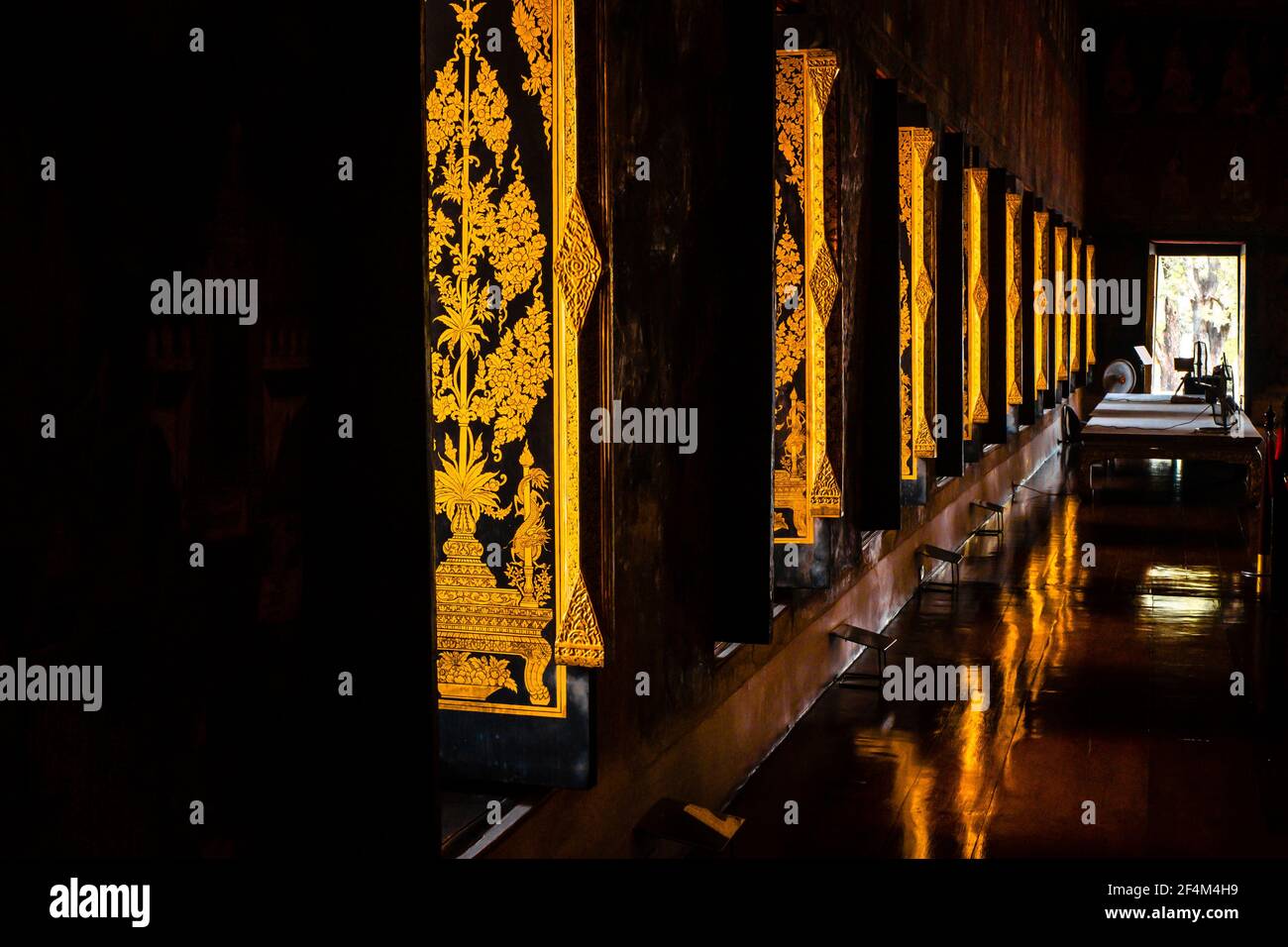 Traditional Thai art courage engraved painting in Buddhist window at ...