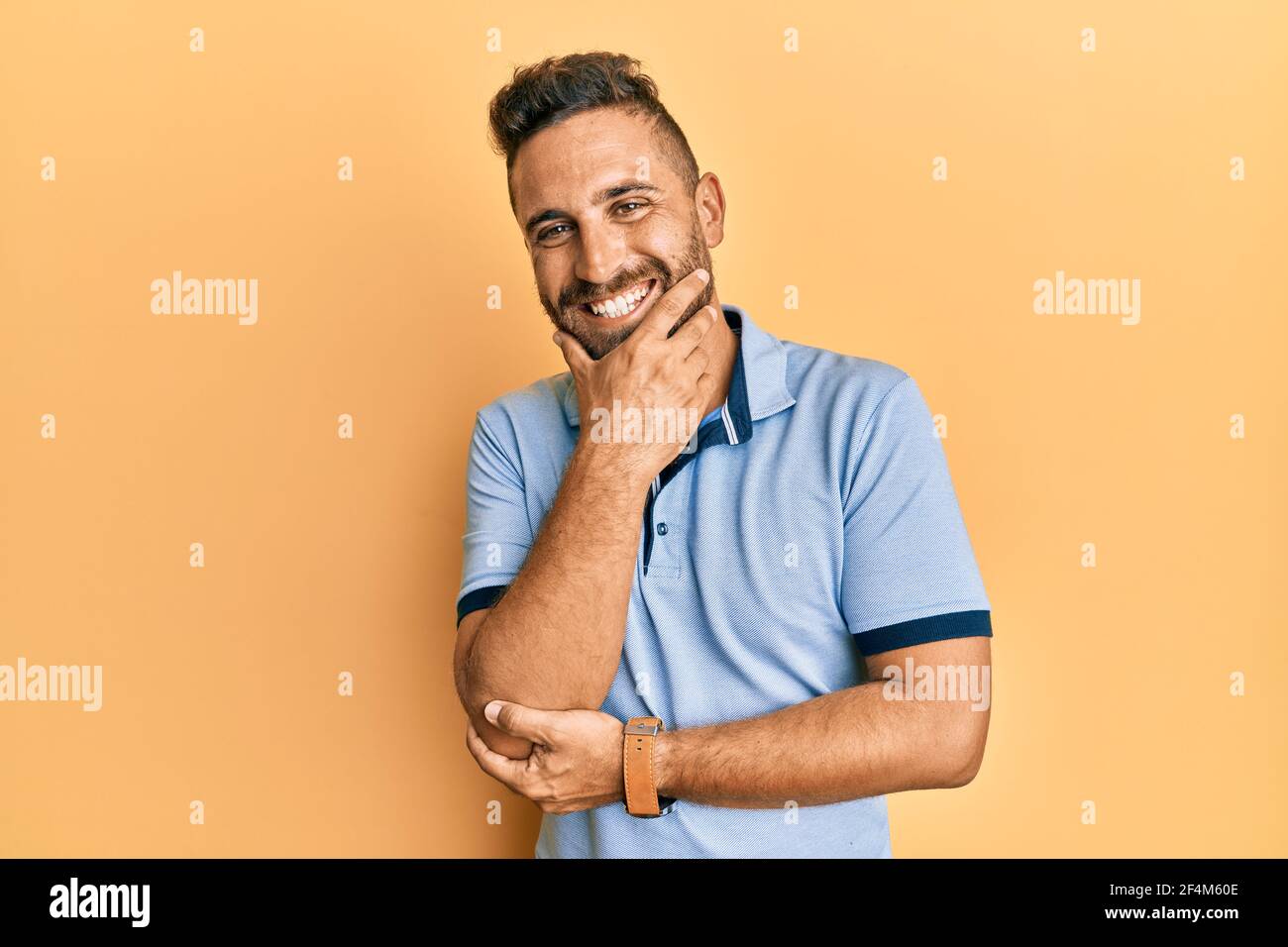 Handsome man with beard wearing casual clothes looking confident at the ...