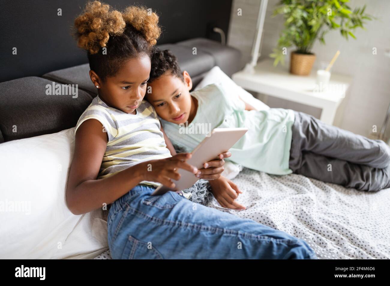 Children who use too much technology, device are not so creative Stock ...