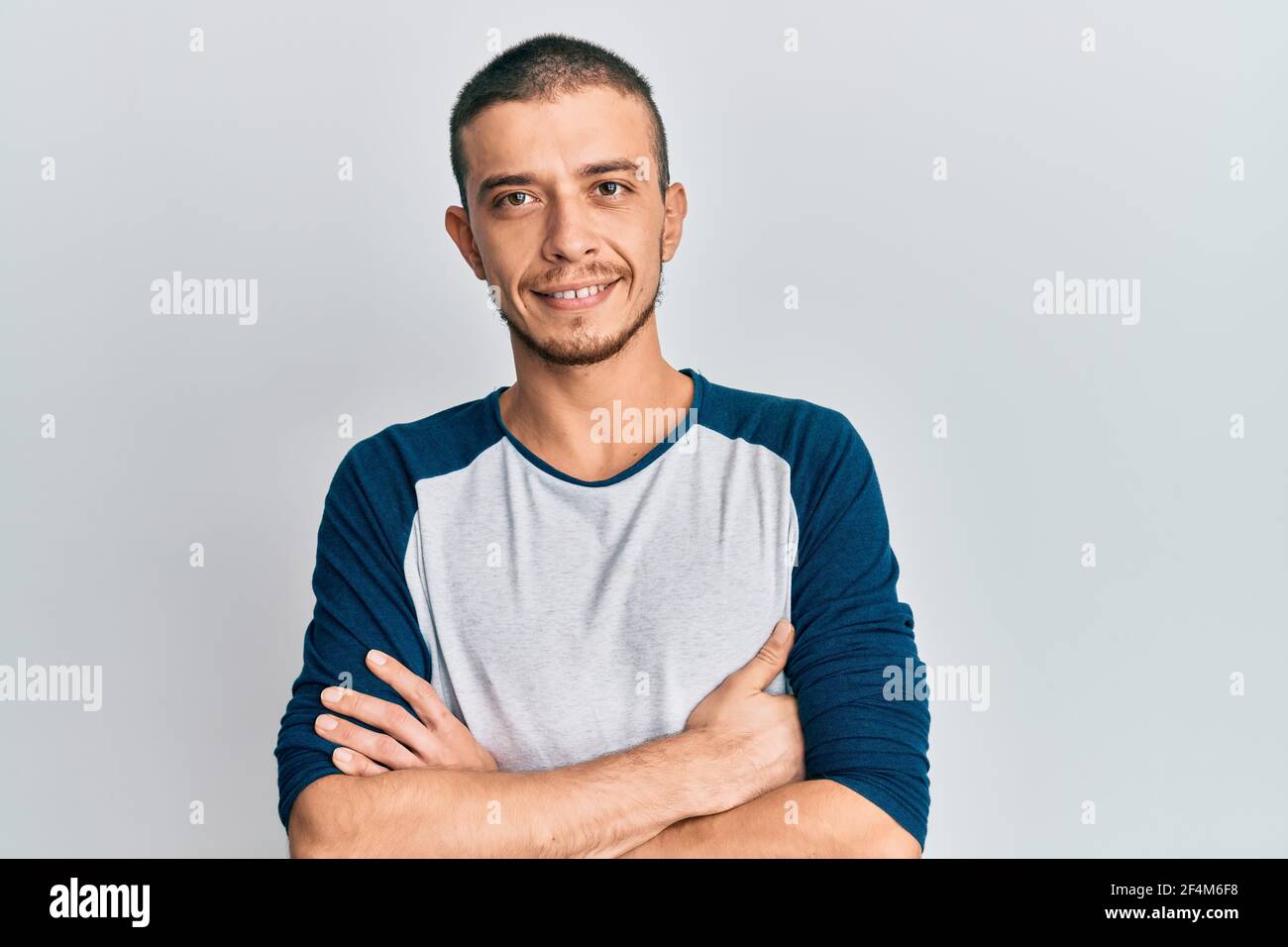 Hispanic Young Man Wearing Casual Clothes Happy Face Smiling With