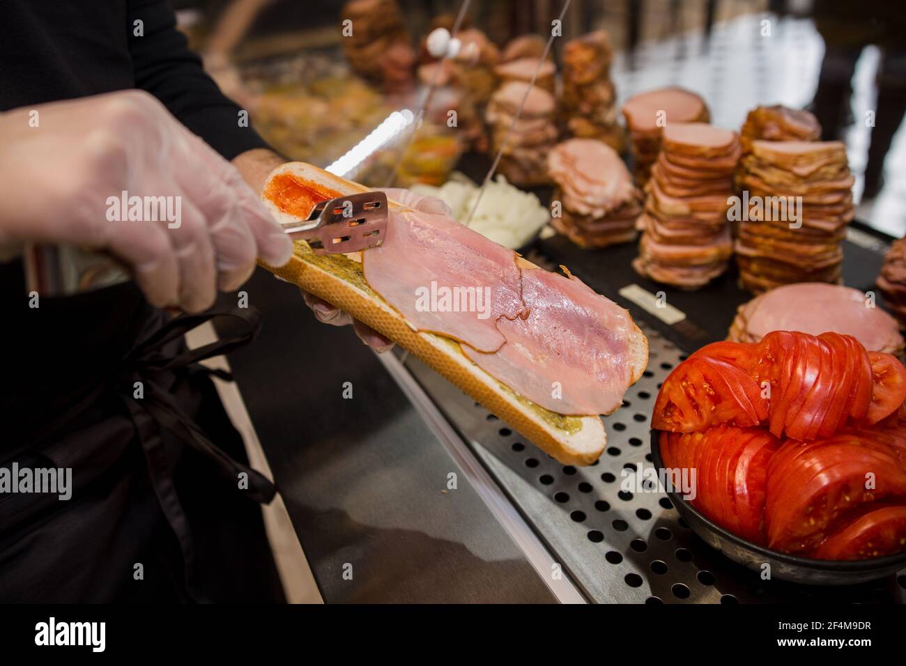 Man making ham sandwich hi-res stock photography and images - Alamy