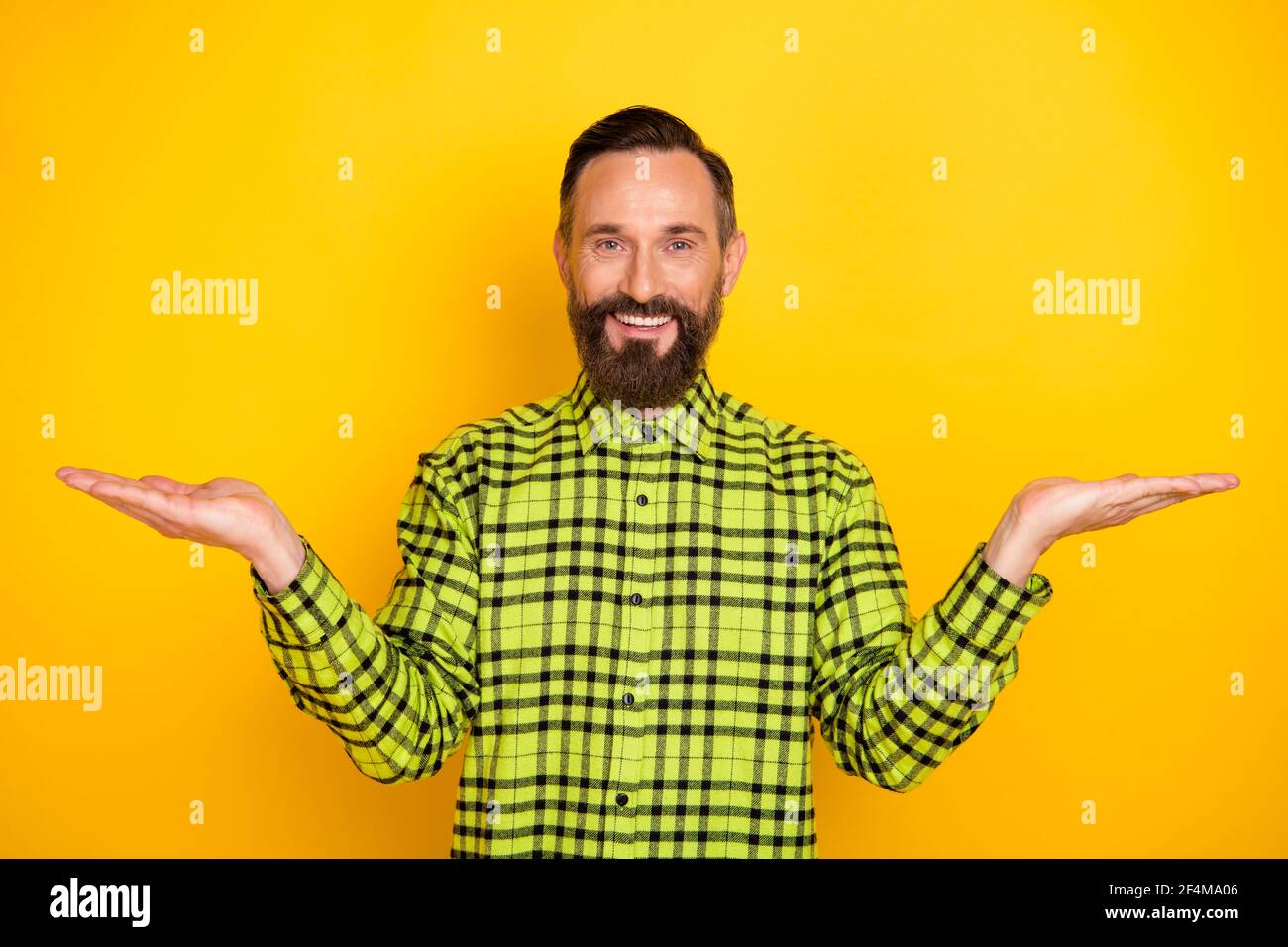 Photo of mature man happy positive smile hold two hands advert promo ...