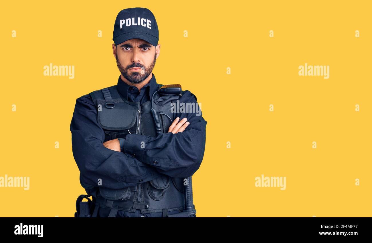 Young hispanic man wearing police uniform skeptic and nervous ...