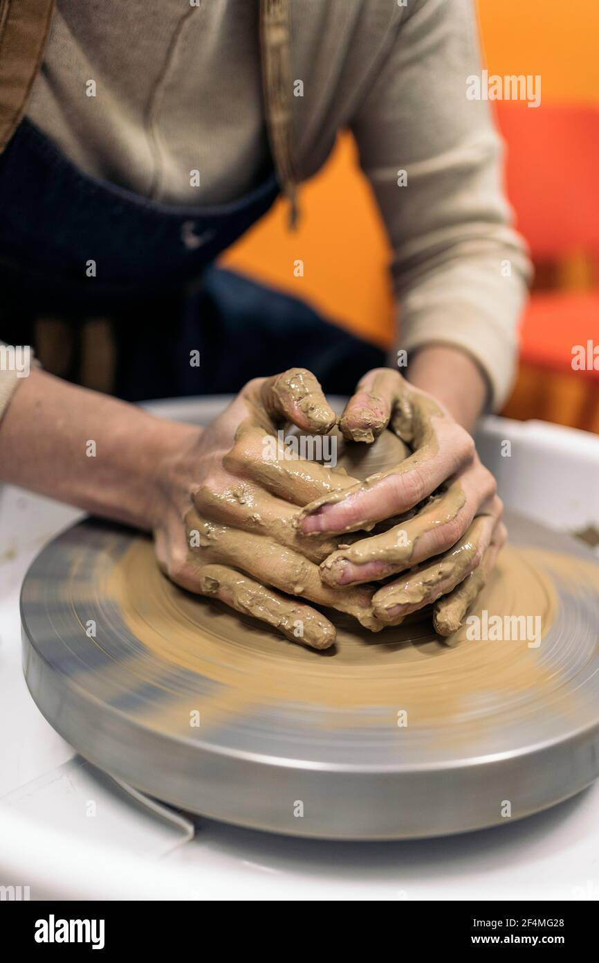 Stock photo of unrecognized person using potter's wheel during pottery ...