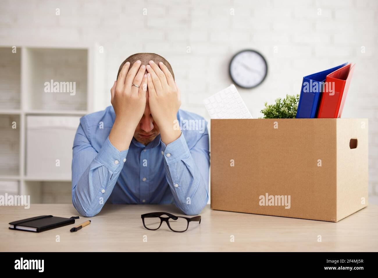 financial crisis, jobless and depression concept - fired worker sitting ...