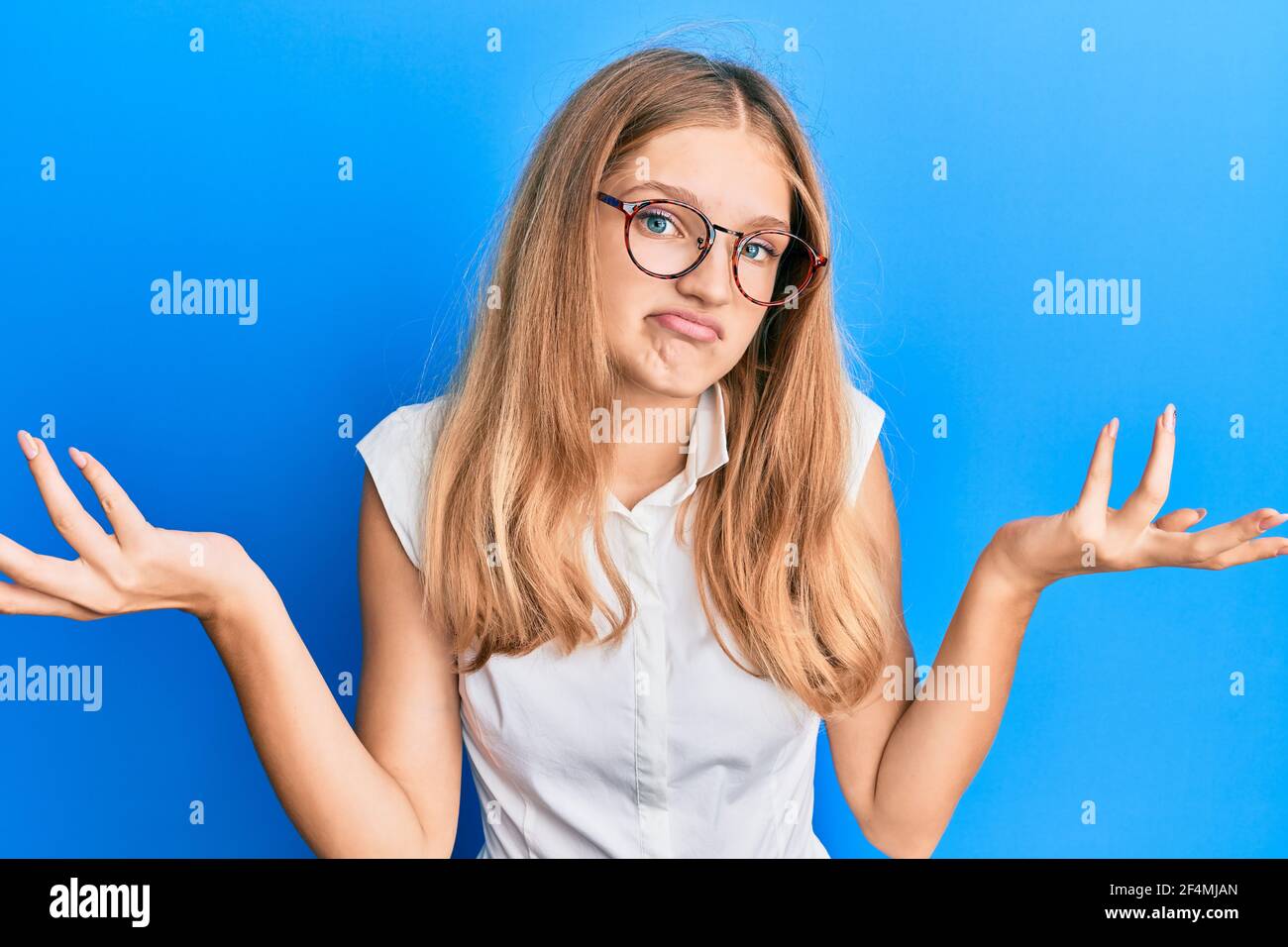 Beautiful young caucasian girl wearing casual clothes and glasses ...