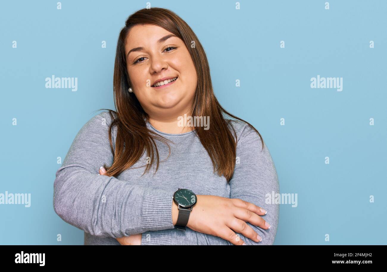 Beautiful brunette plus size woman wearing casual clothes happy face ...