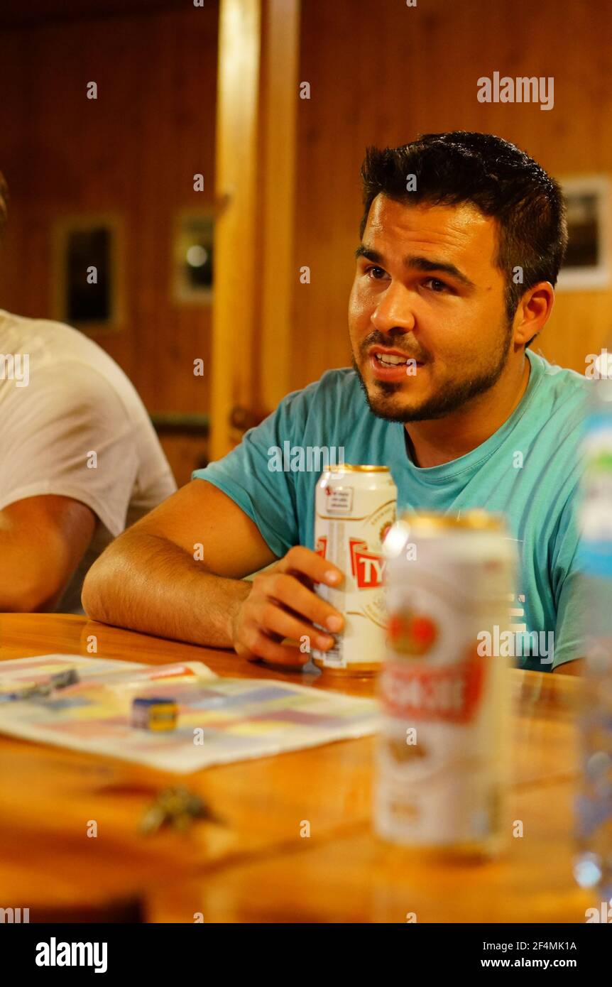 TLEN, POLAND - Aug 23, 2015: Man sitting by a table and drinking beer ...