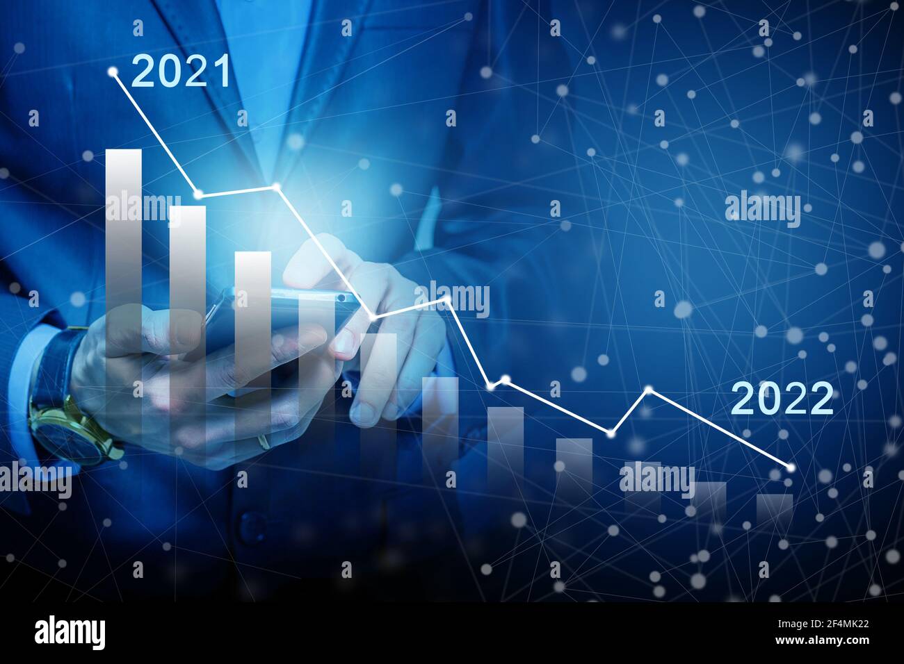 Businessman's hand holds a stock graph display in a visual screen. It ...