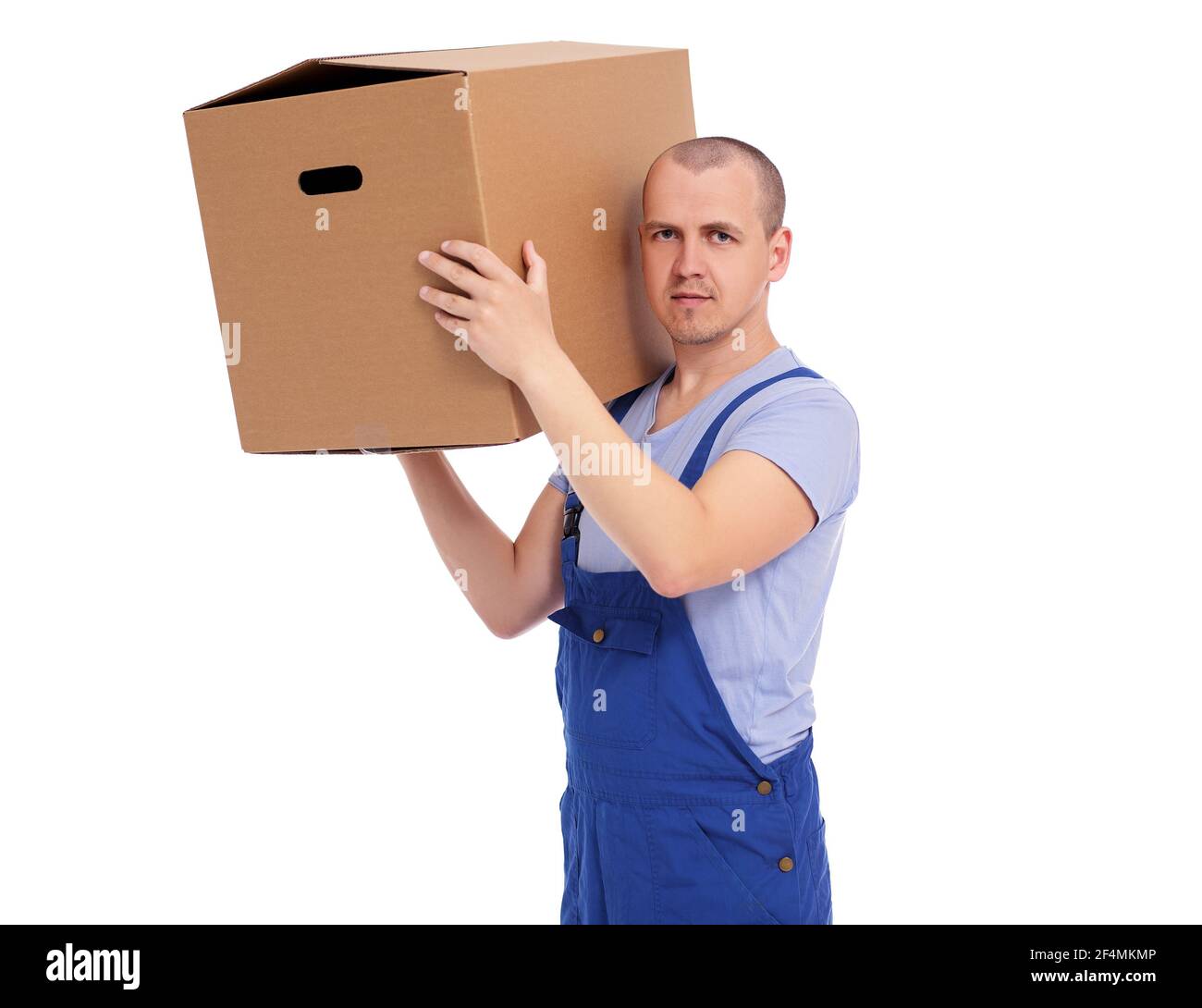 portrait of man loader in uniform with big box on his shoulder isolated ...